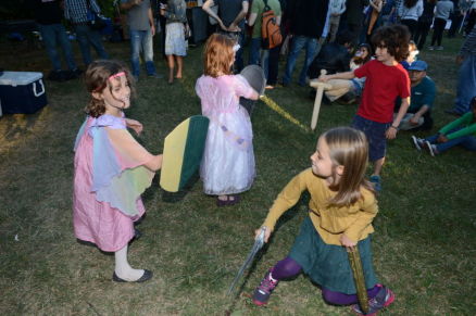 Chilren practice jousting among their peers on the lawn. : Photo ...